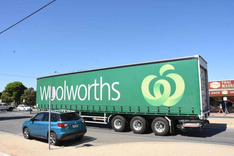 Woolies truck drops container off out the front of IGA | Cobram Courier