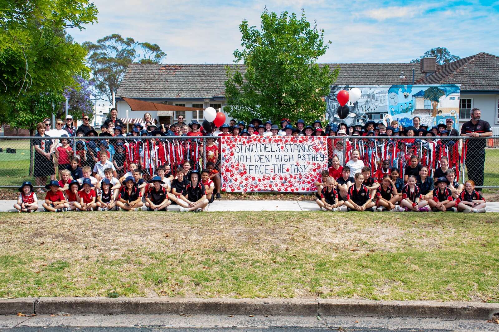 We Stand with Deni High: A sea of back, red and white for DHS ...