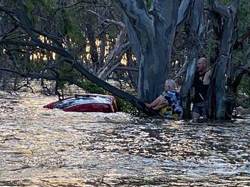 Rescuer risks life to save woman as floods swamp towns | Cobram Courier