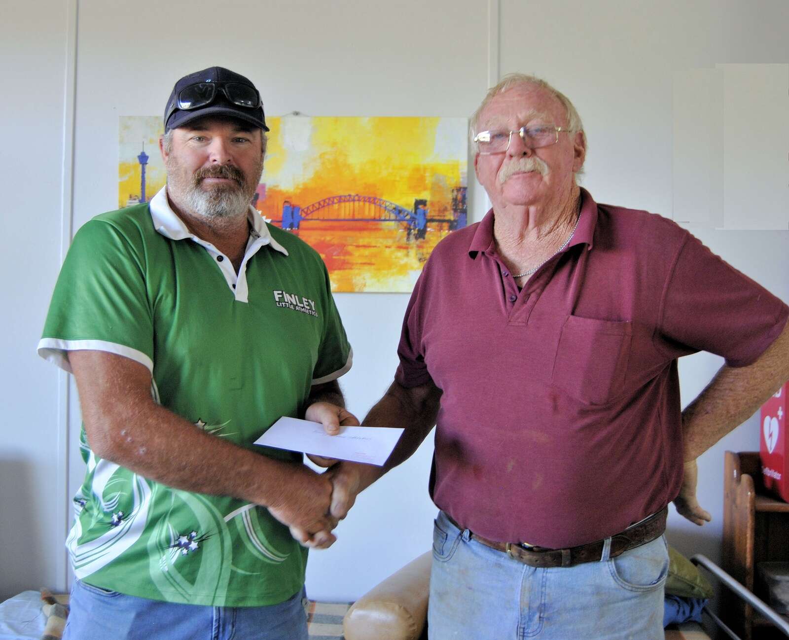 Men supporting each other, and the community | Benalla Ensign