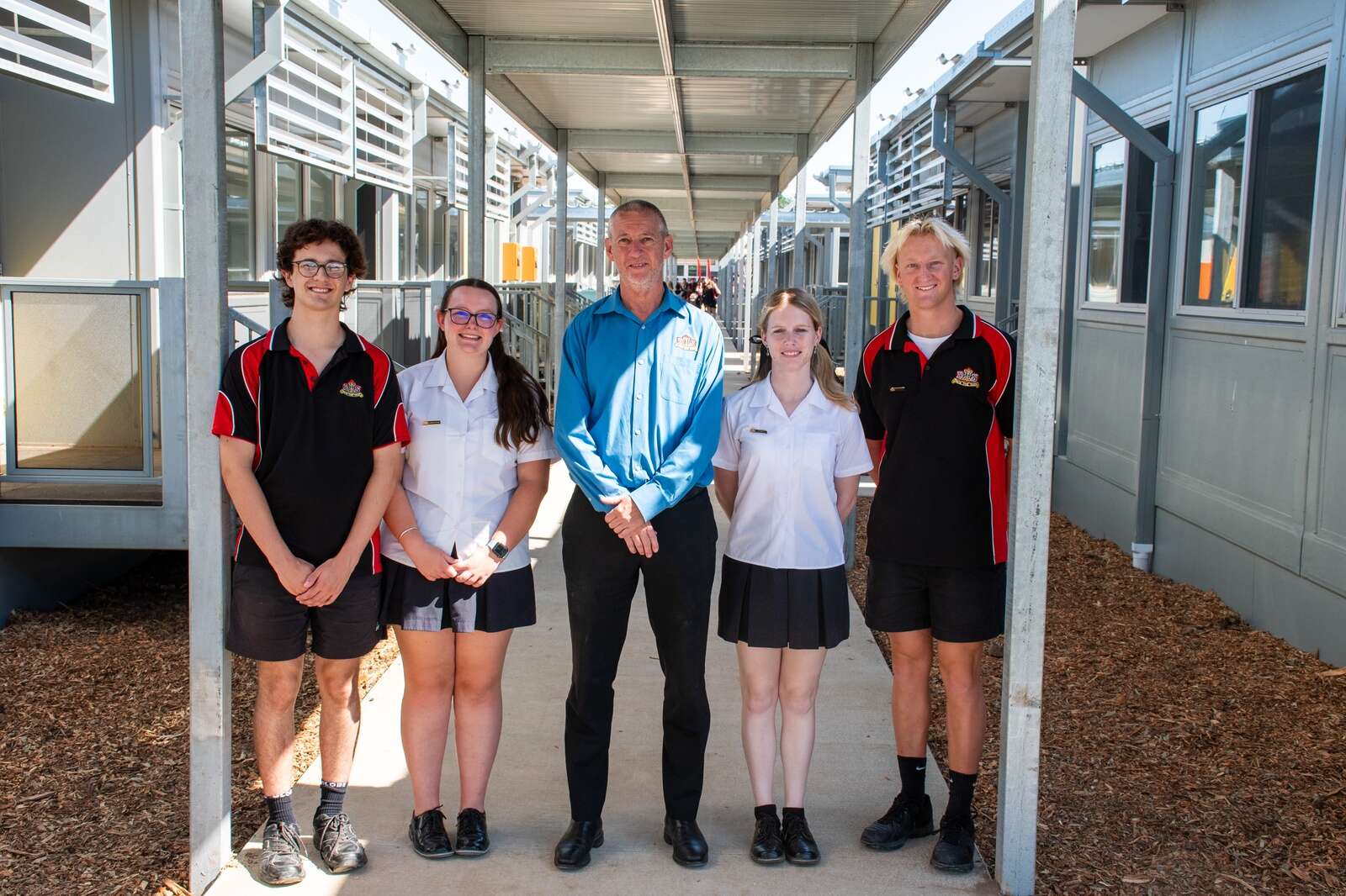 Deni High students settle into new year as campus rebuild takes shape ...
