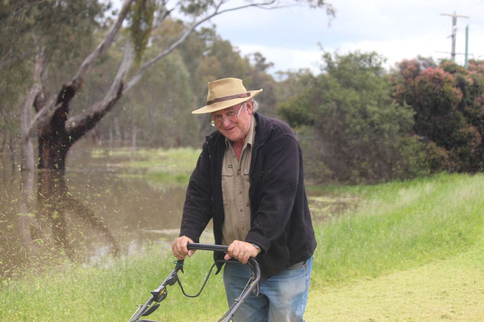 ‘A beautiful Saturday afternoon’: Mowing the lawn as the flood rolls in ...
