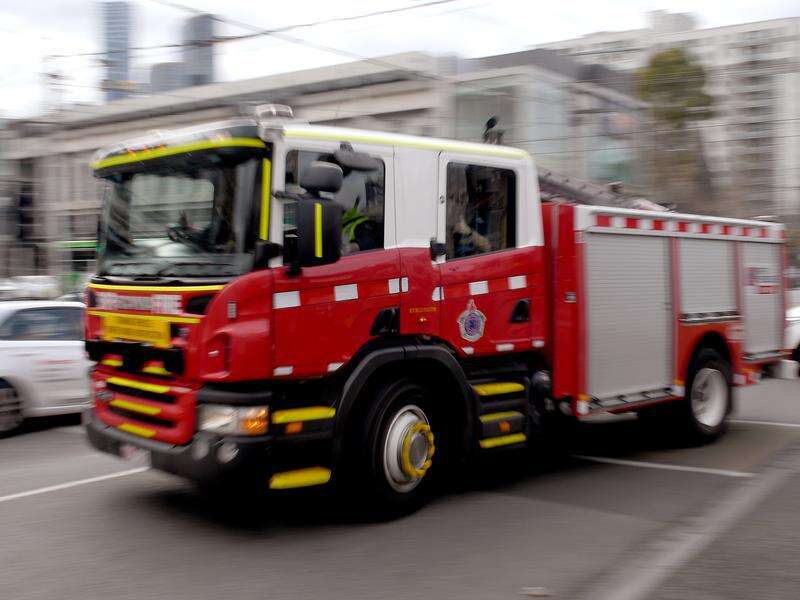 Two dead after 'targeted' panel shop fire spreads | Country News
